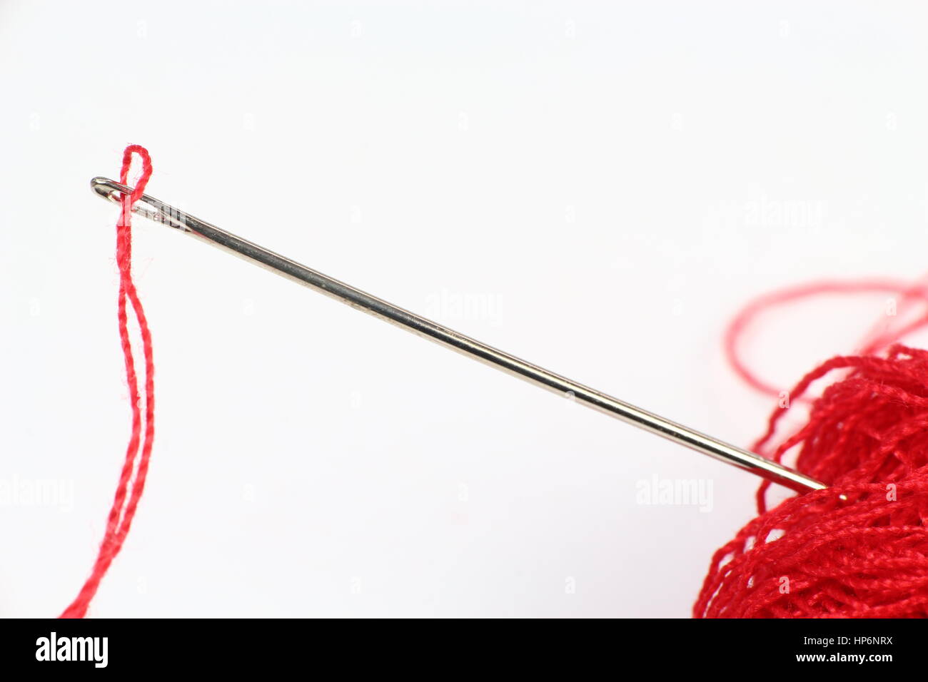 Needle and string Stock Photo - Alamy