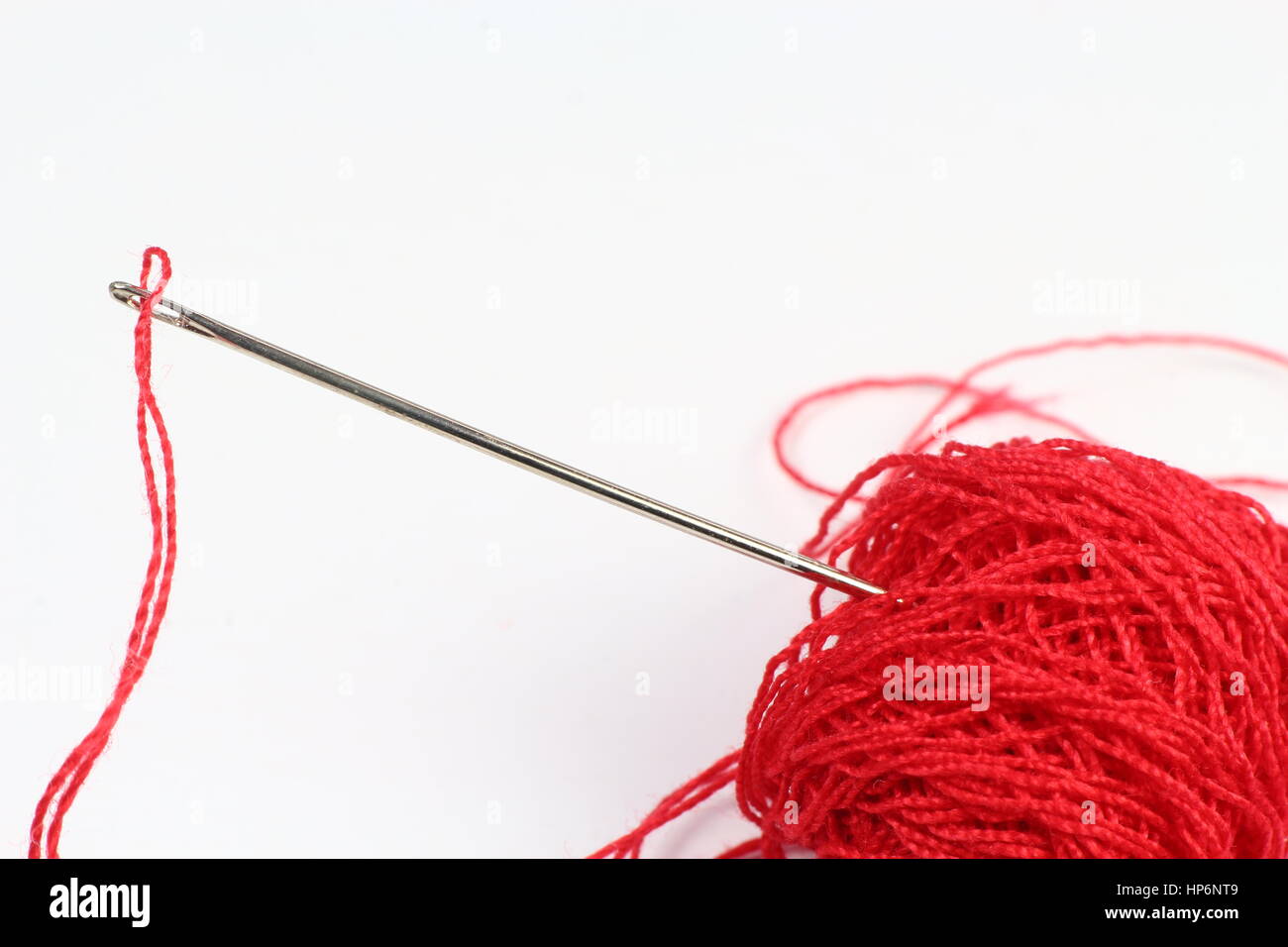 Needle and string Stock Photo - Alamy