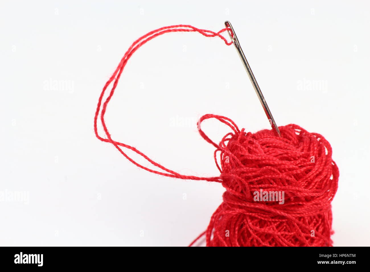 Needle and string Stock Photo - Alamy