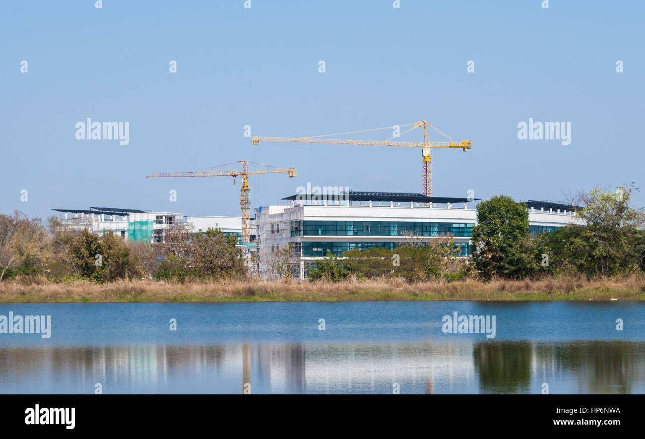 Construction with Crane behind The Lake Stock Photo - Alamy