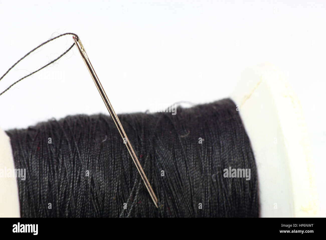 Needle and string Stock Photo - Alamy