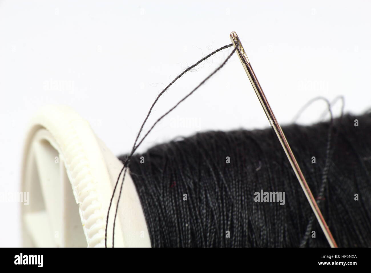 Needle and string Stock Photo - Alamy