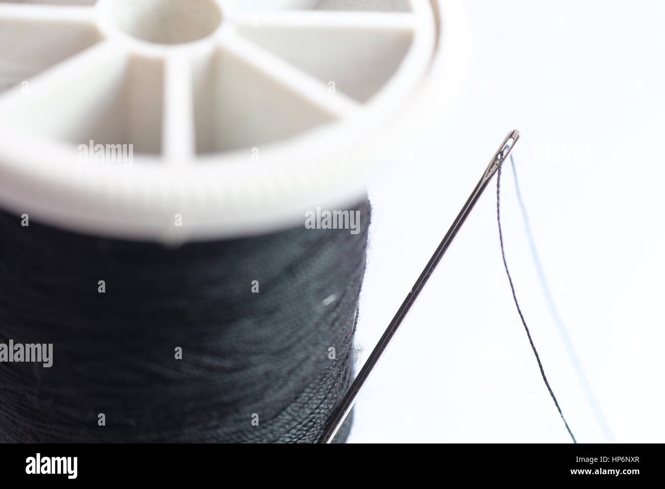 Needle and string Stock Photo - Alamy