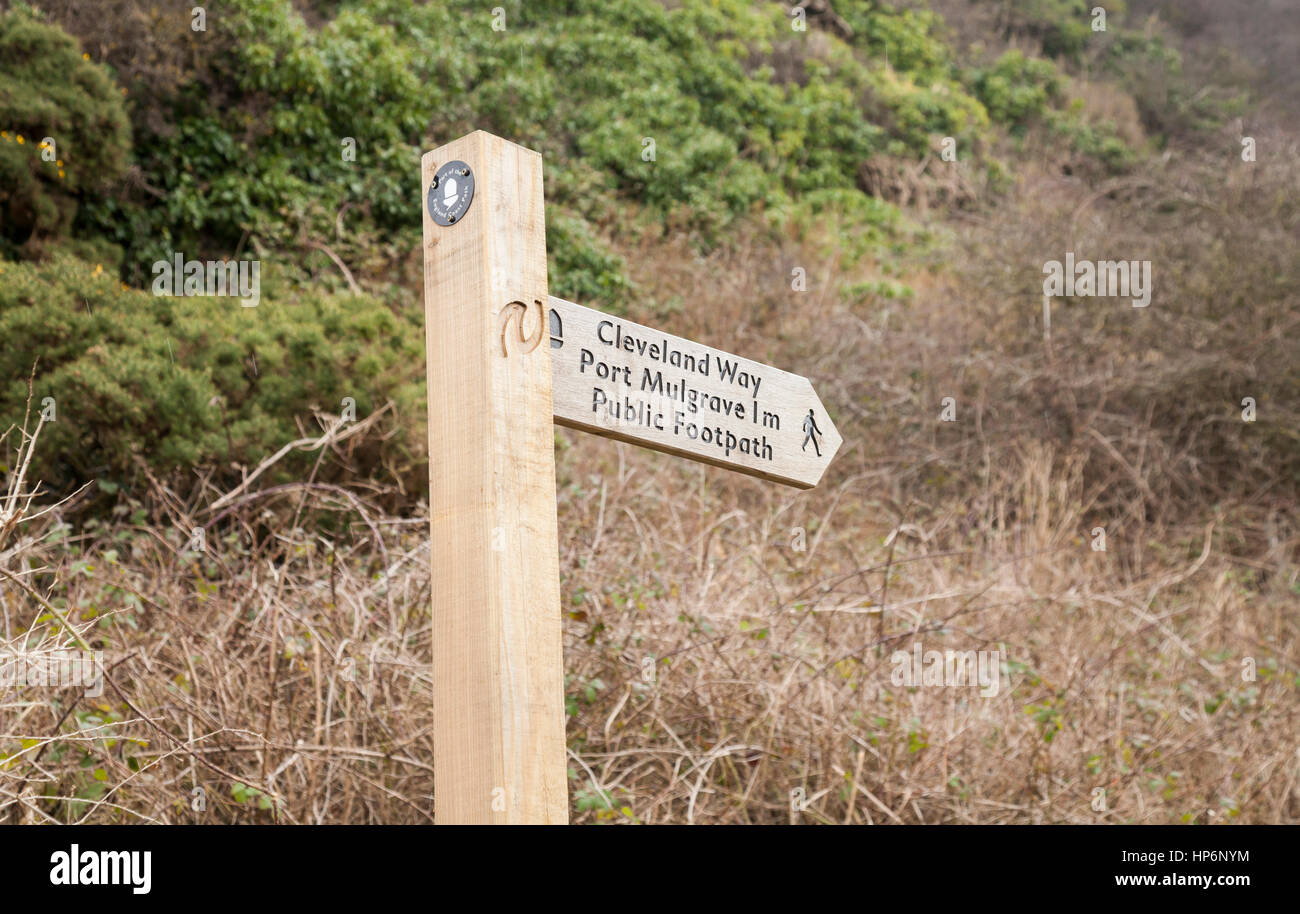 A Cleveland Way wooden sign post in Staithes,North Yorkshire, showing ...
