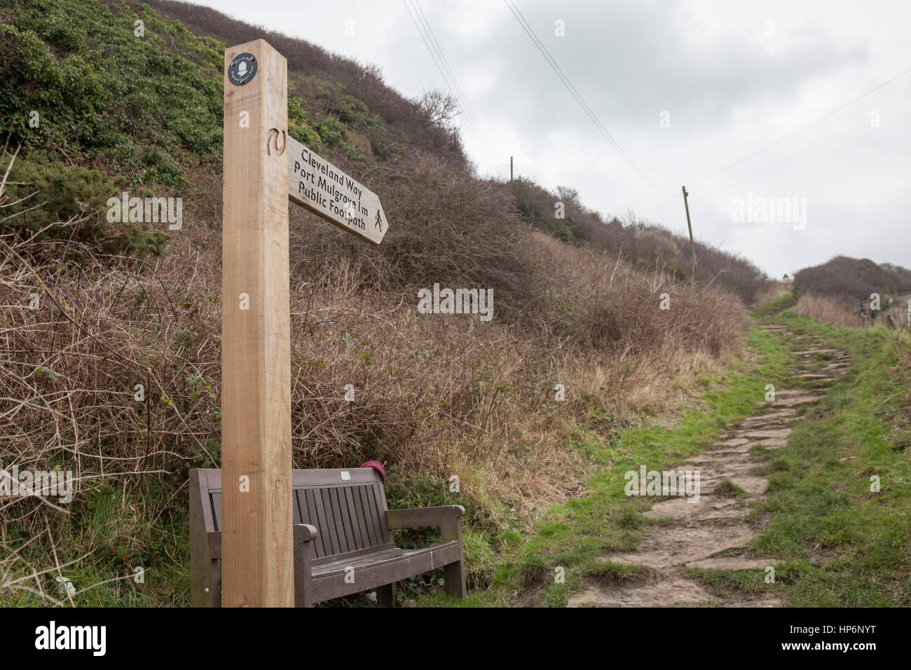 A Cleveland Way wooden sign post in Staithes,North Yorkshire, showing ...