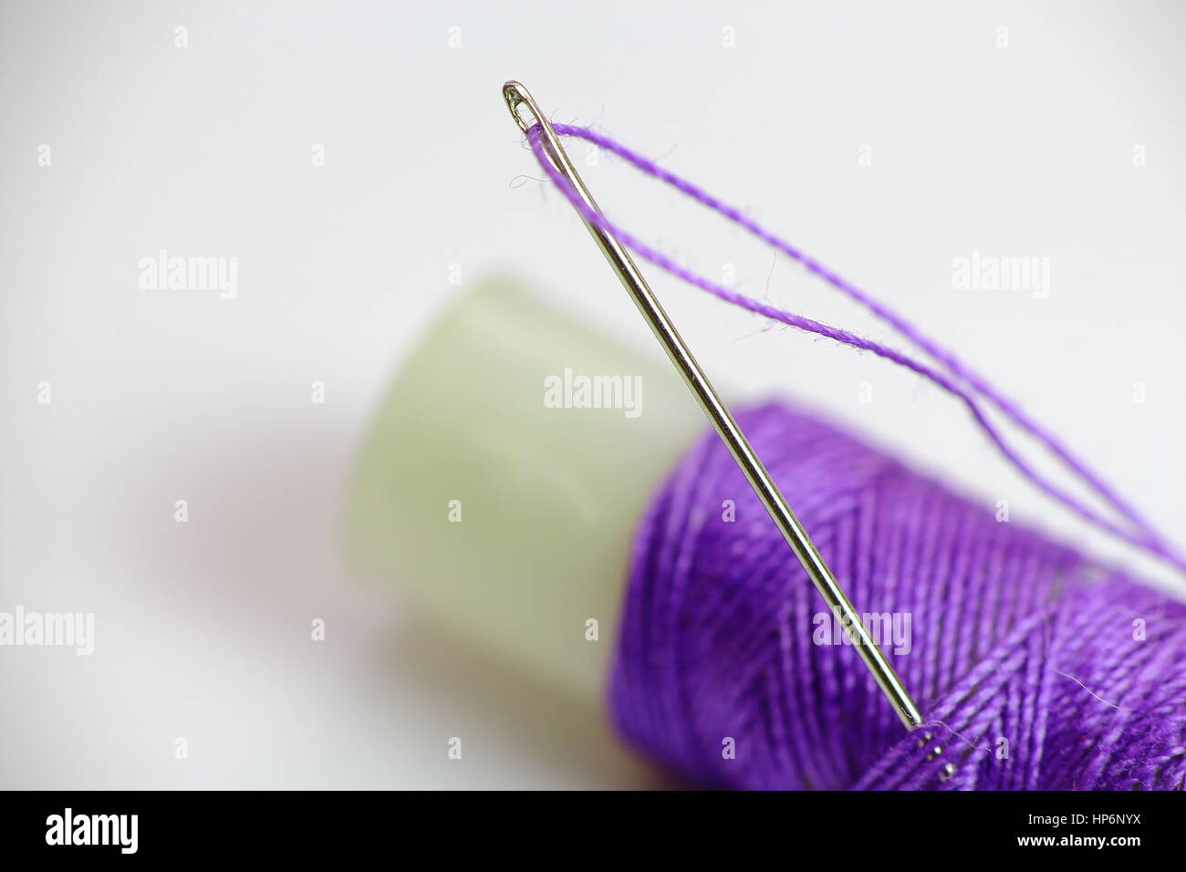 Needle and string Stock Photo - Alamy