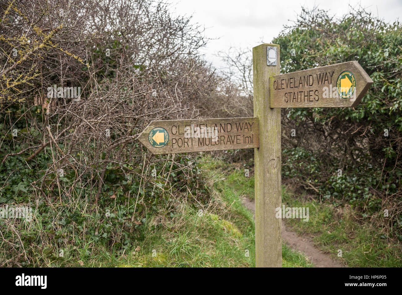 A Cleveland Way wooden sign post in Staithes,North Yorkshire, showing ...