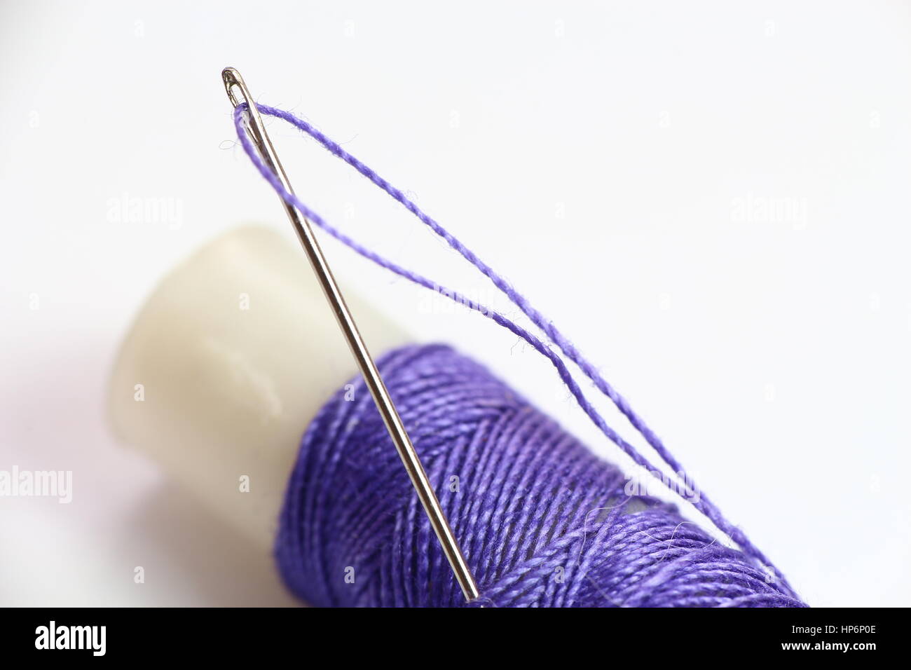 Needle and string Stock Photo - Alamy