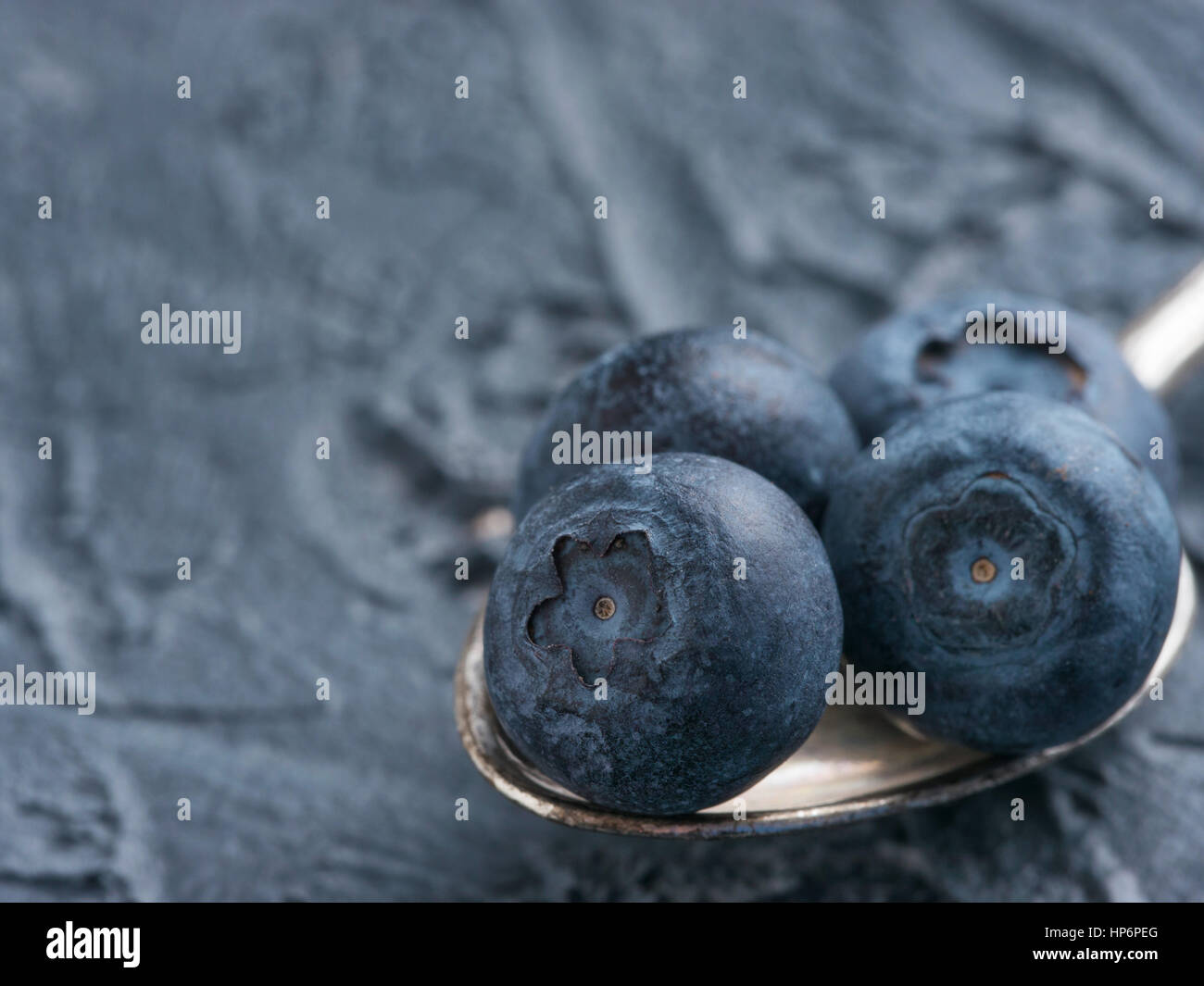 Freshly picked blueberries in spoon closeup. Ripe and juicy fresh ...
