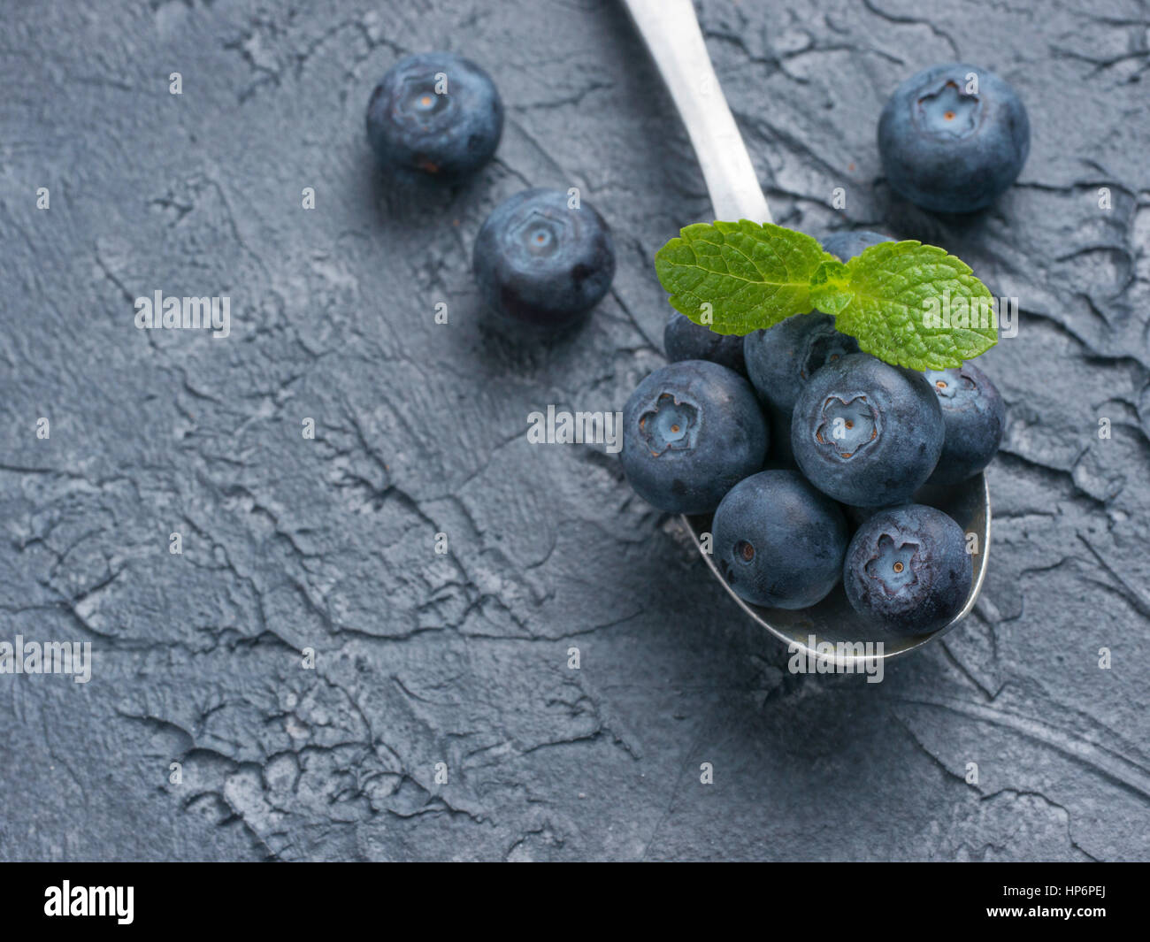 Freshly picked blueberries in spoon closeup. Ripe and juicy fresh ...