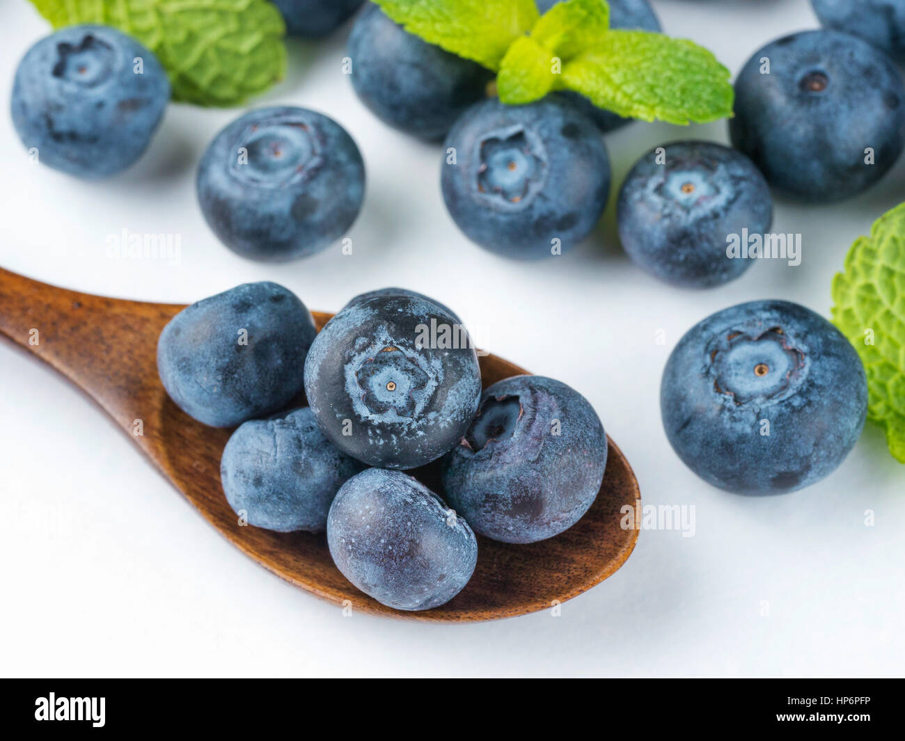 Freshly picked blueberries in wooden spoon closeup. Ripe and juicy ...