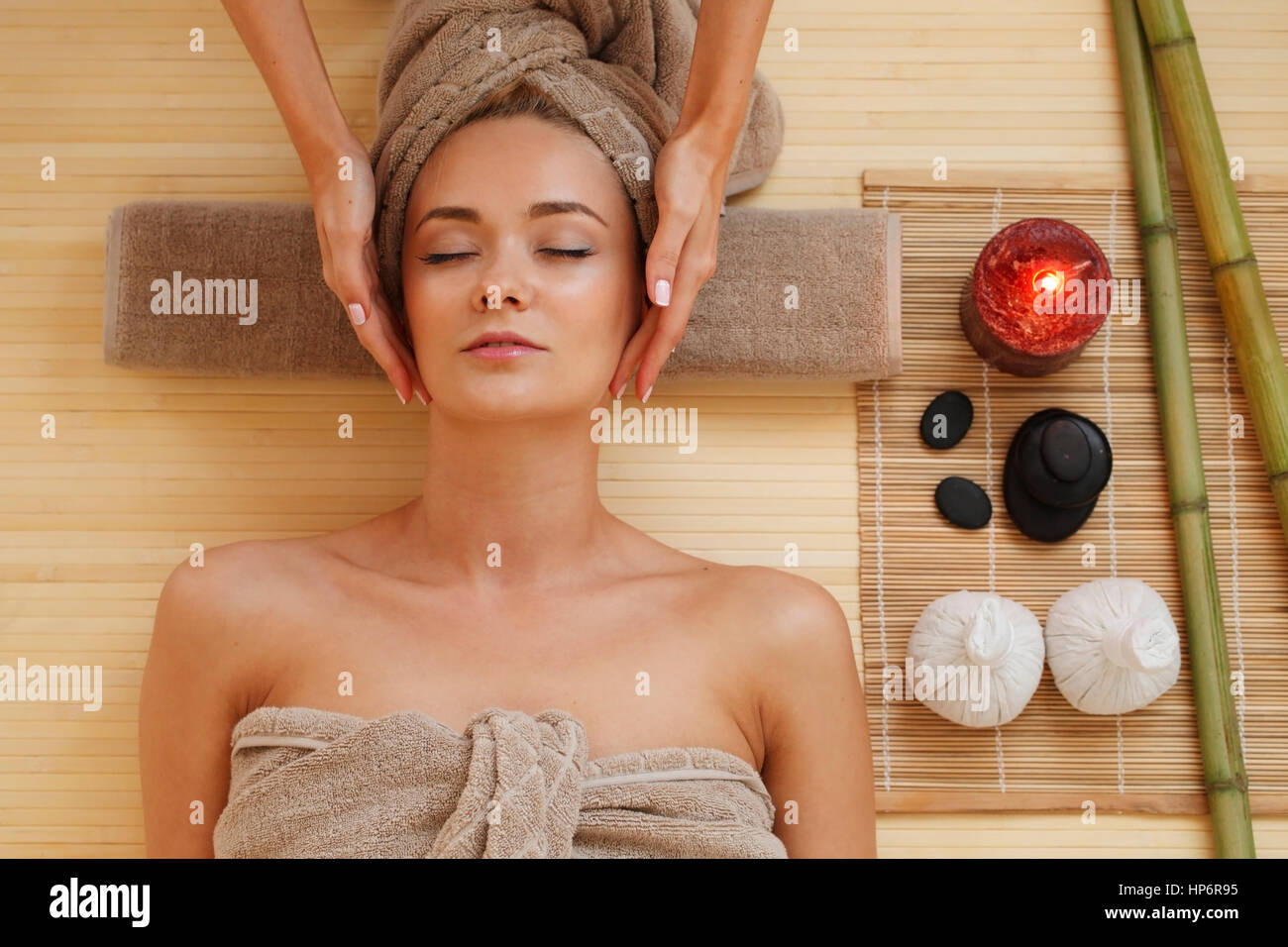 Beautiful young woman relaxing in spa salon Stock Photo - Alamy