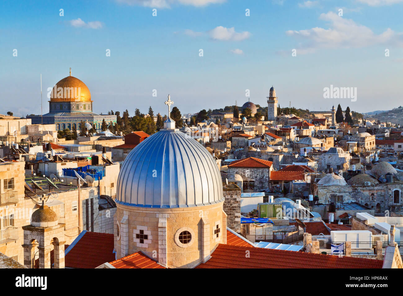 A view on rooftops of Old City of Jerusalem. Grey dome of Church of Our ...