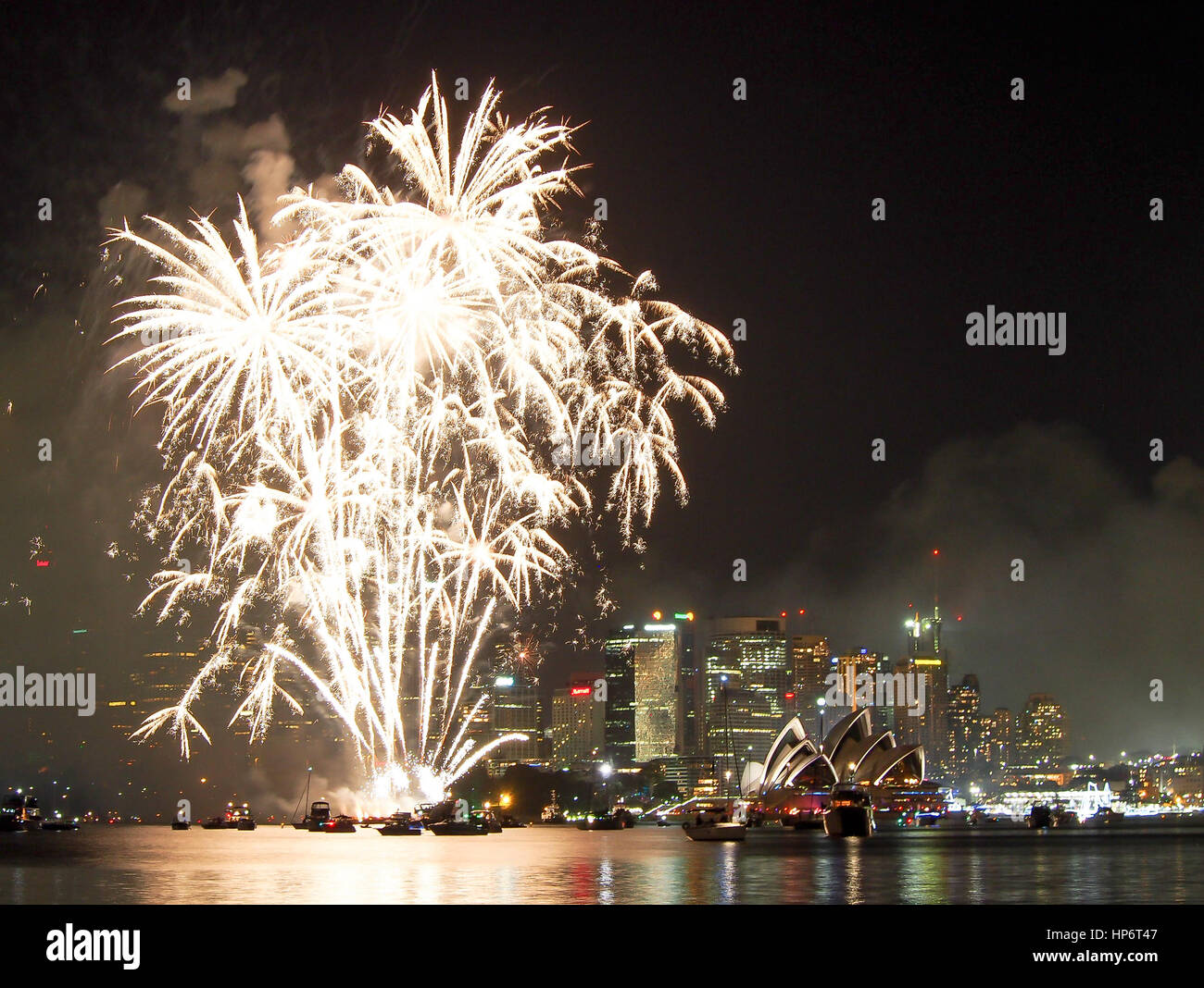 Fireworks over Sydney Harbor with the Sydney Opera House lit up on New ...