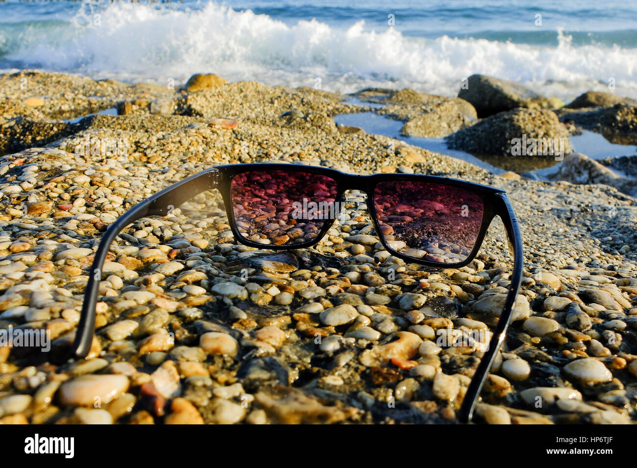 Black sunglasses at sea background Stock Photo - Alamy