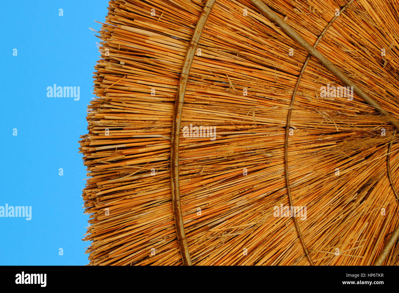 Beach umbrella made of straw Stock Photo - Alamy