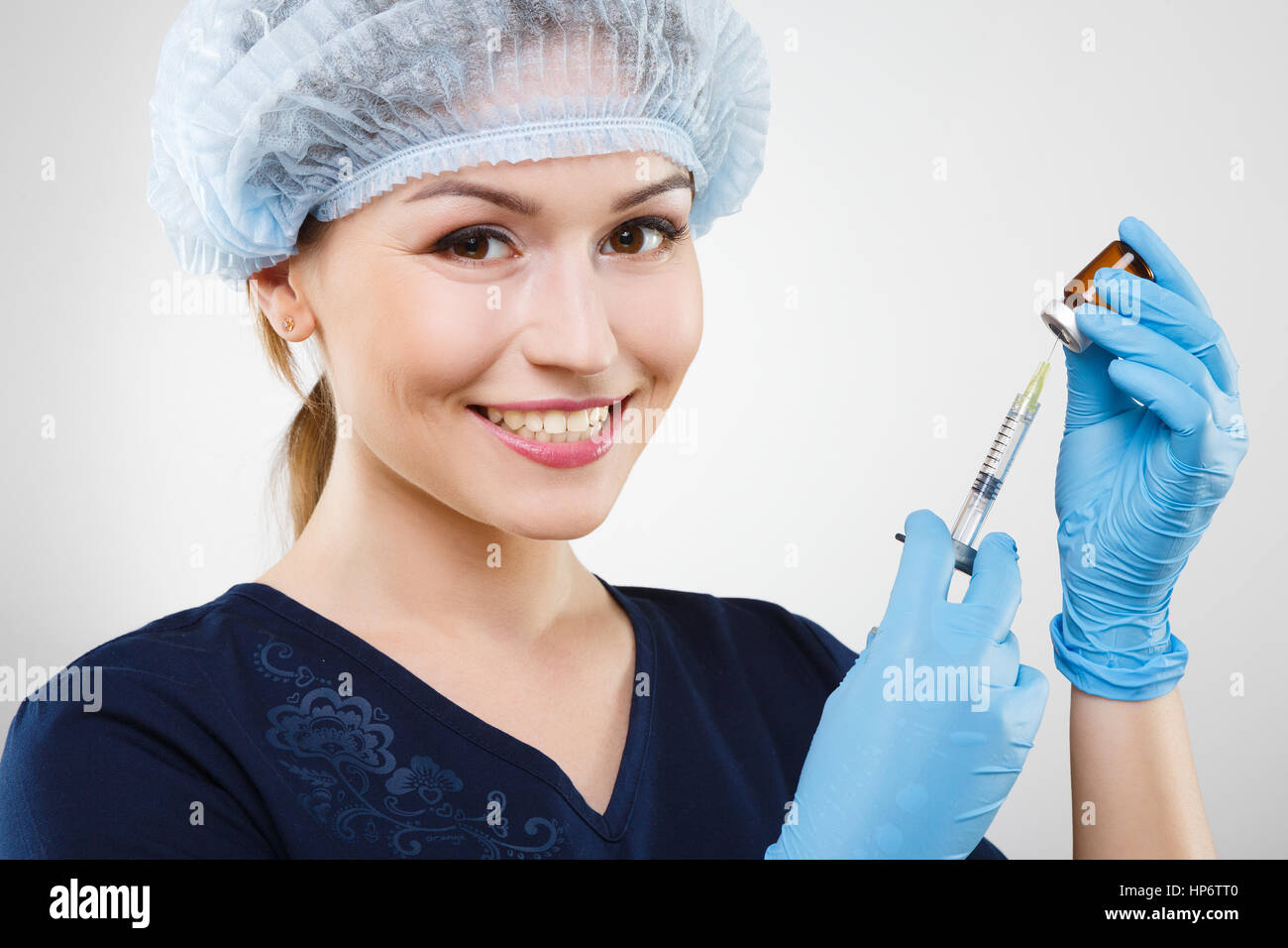 Pretty girl in medical uniform Stock Photo - Alamy