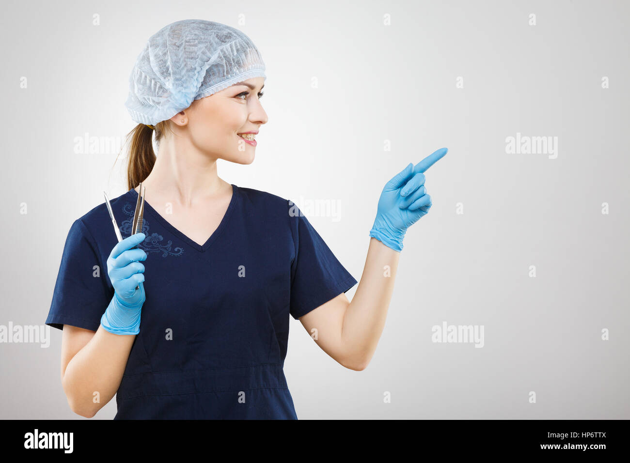 Beautiful nurse in blue medical uniform Stock Photo - Alamy