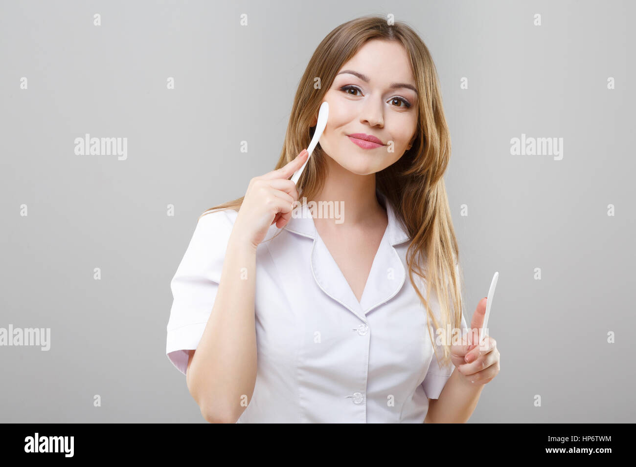 Pretty nurse at studio background Stock Photo - Alamy