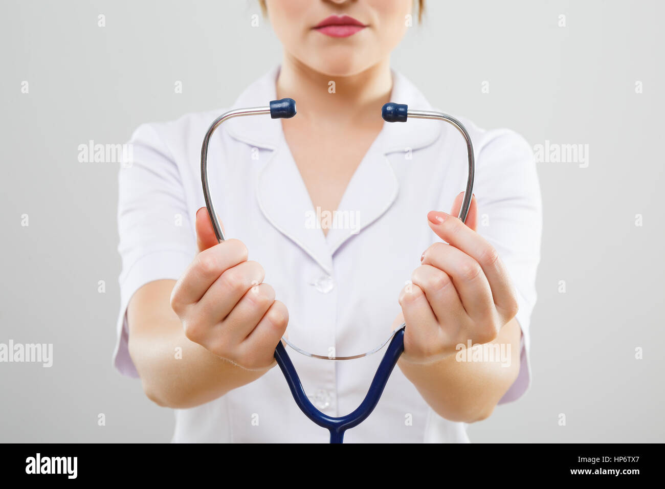 Hands holding stethoscopes Stock Photo - Alamy
