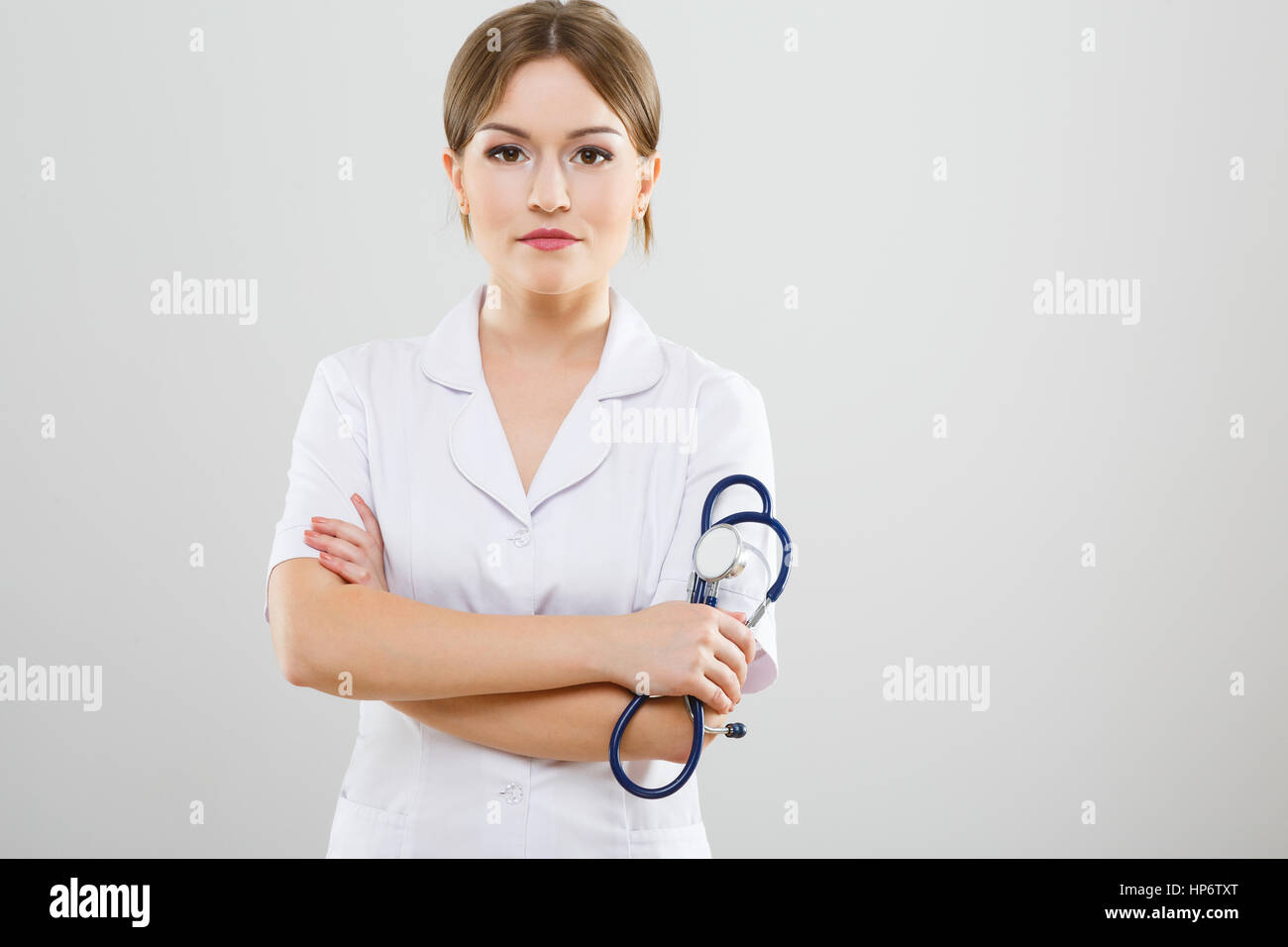Beautiful nurse in white medical robe Stock Photo - Alamy