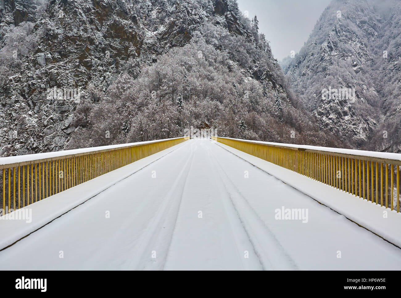 Bridge over mountain river in winter time Stock Photo - Alamy