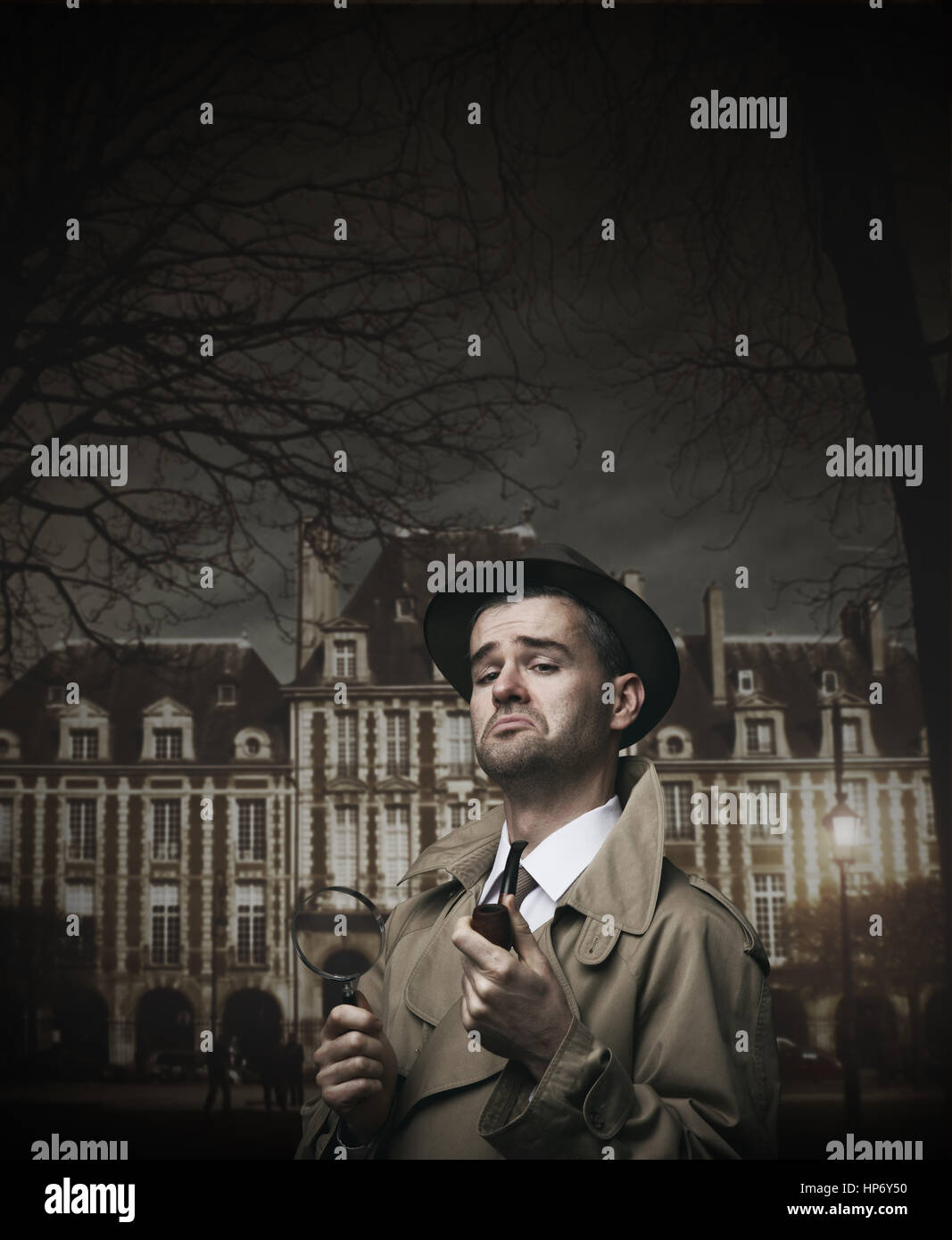 Funny vintage investigator in trench coat holding a pipe Stock Photo ...
