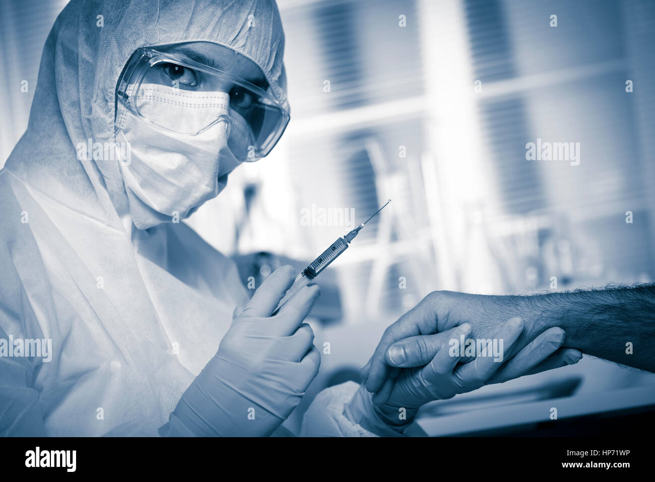 Doctor injecting medication on patient's arm using a syringe Stock ...