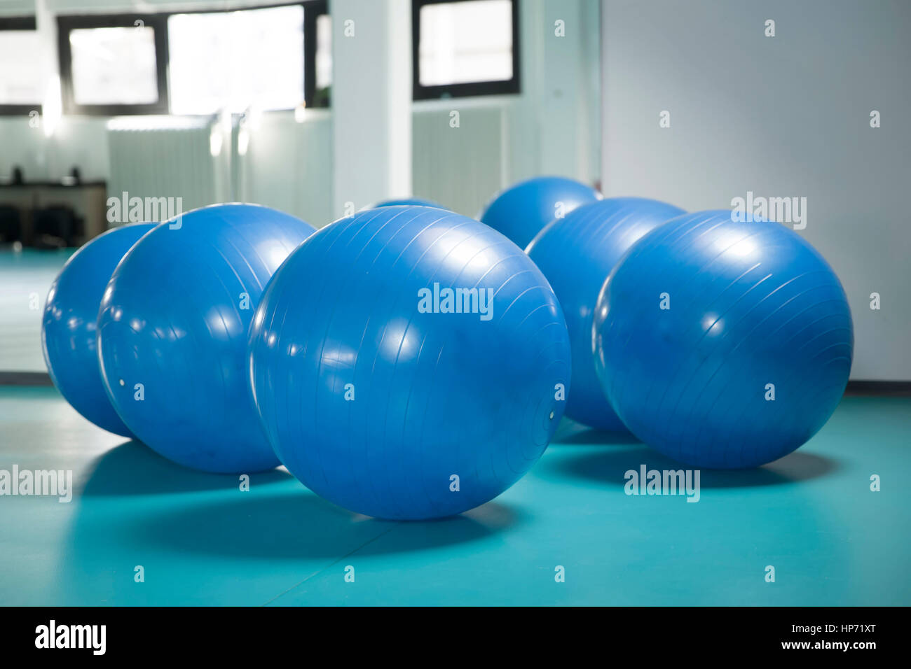 Group of blue pilates balls in the gym Stock Photo - Alamy