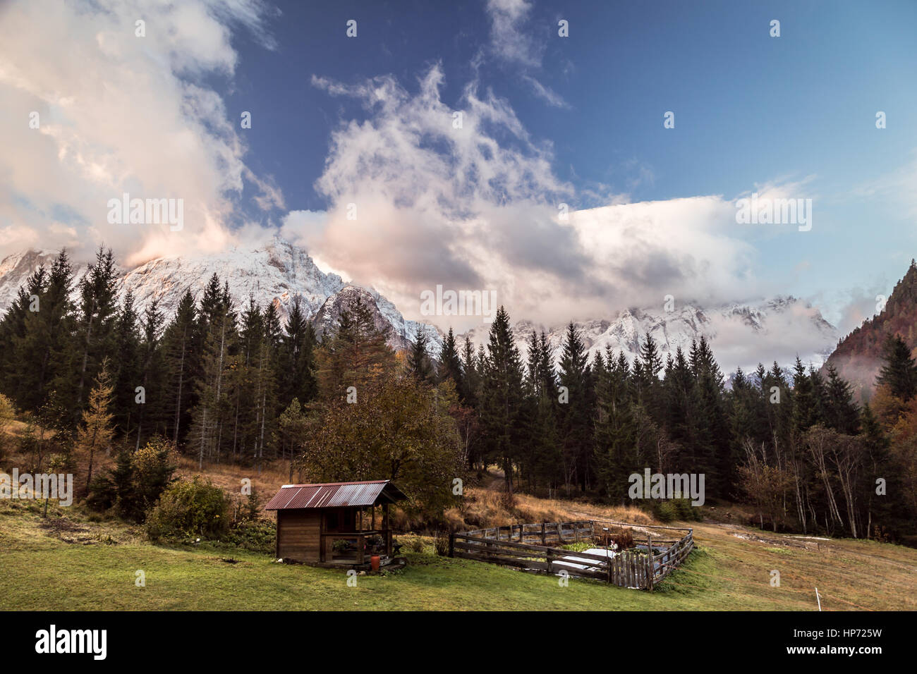an alpine hut in the valley during a colorful sunrise Stock Photo - Alamy