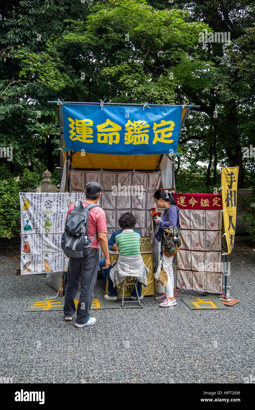 Unidentified people at Fushimi Inari shrine in Kyoto, Japan. It is an ...
