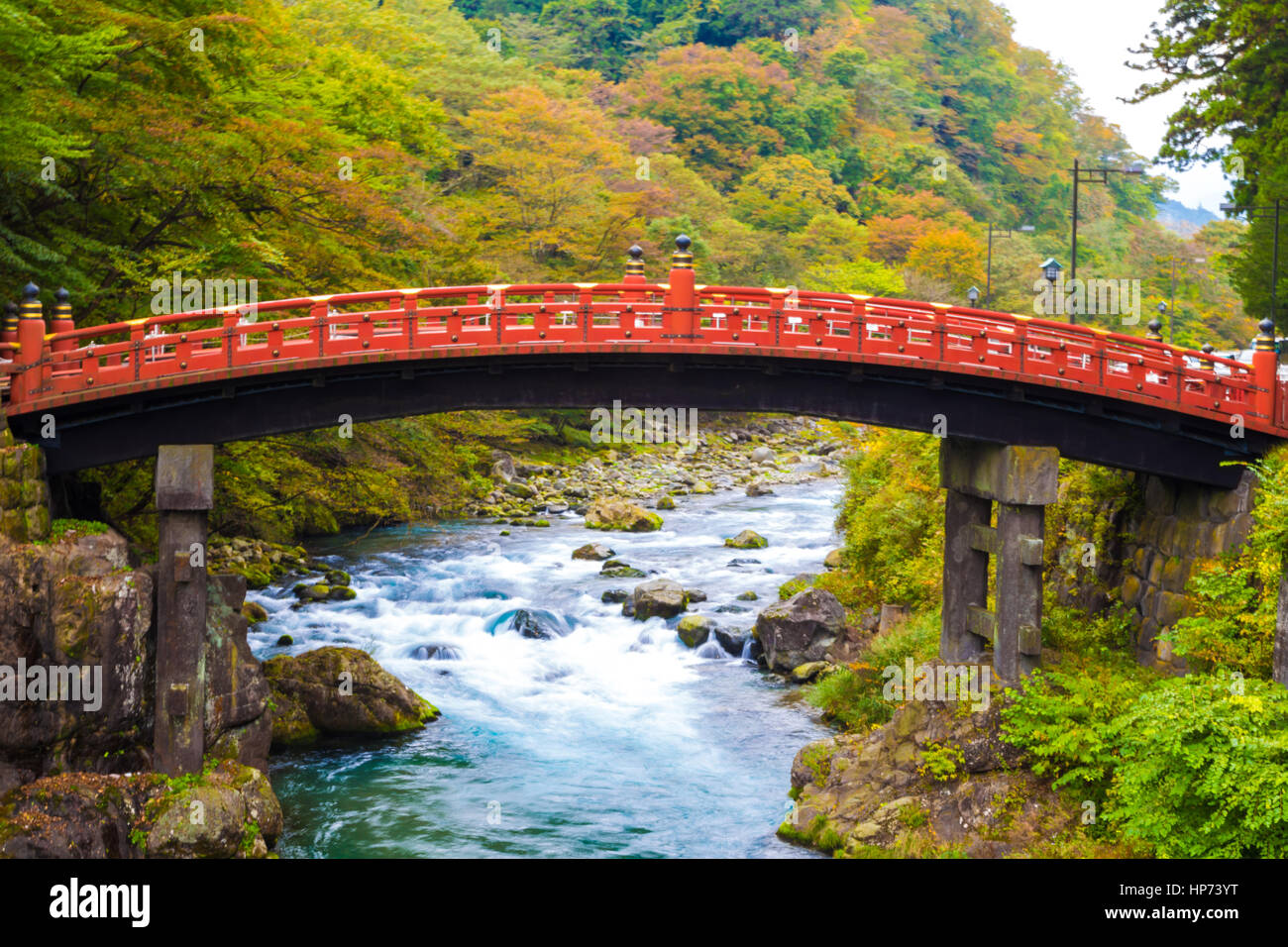 The red Shinkyo Sacred Bridge in autumn, the main way to the Futarasan Shrine in Nikko, Japan ...