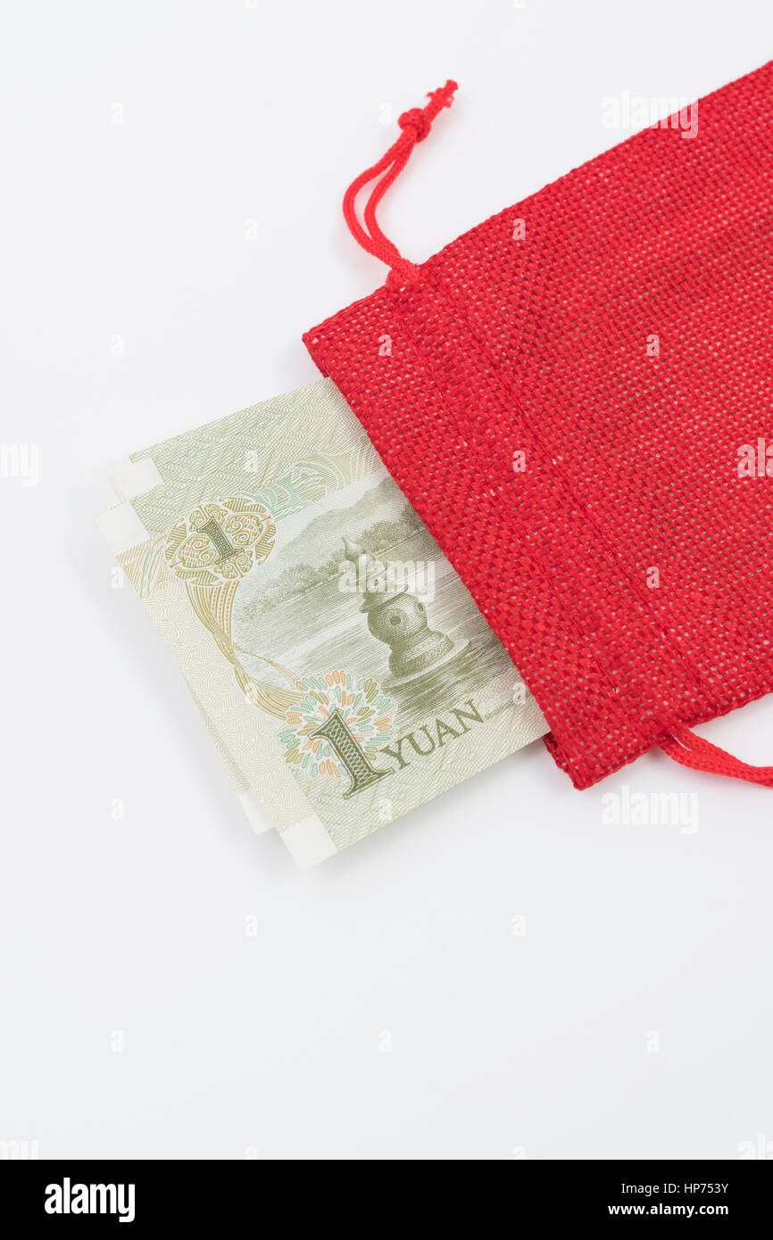 Red cotton purse with Chinese 1 Yuan / Renminbi banknotes. For Chinese ...