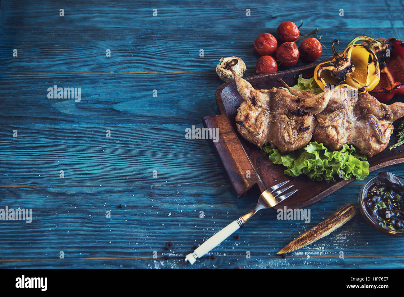 Grilled quail meat Stock Photo - Alamy