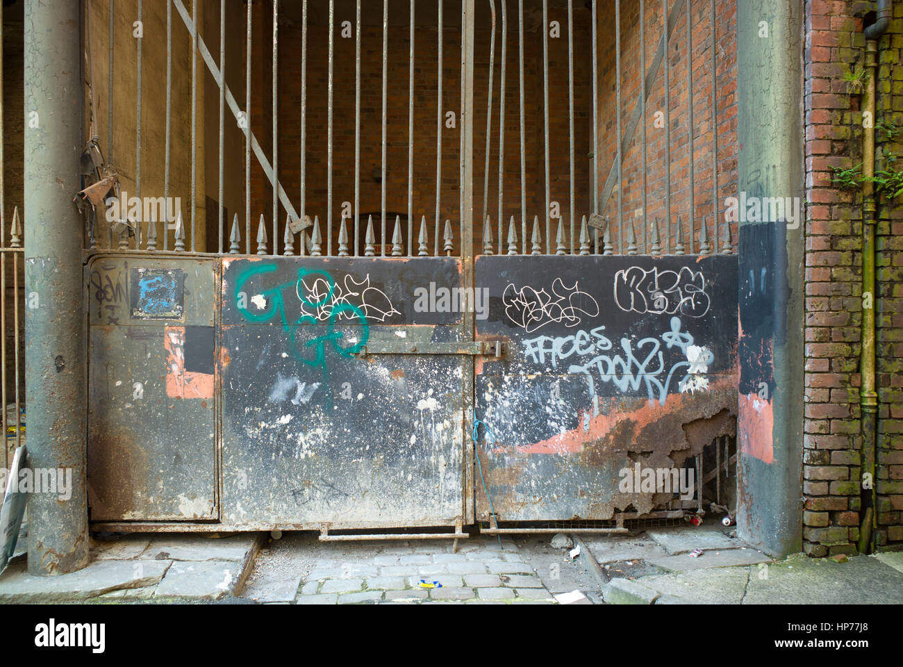 Iron gates across entrance to former warehouse, Manchester, UK Stock ...