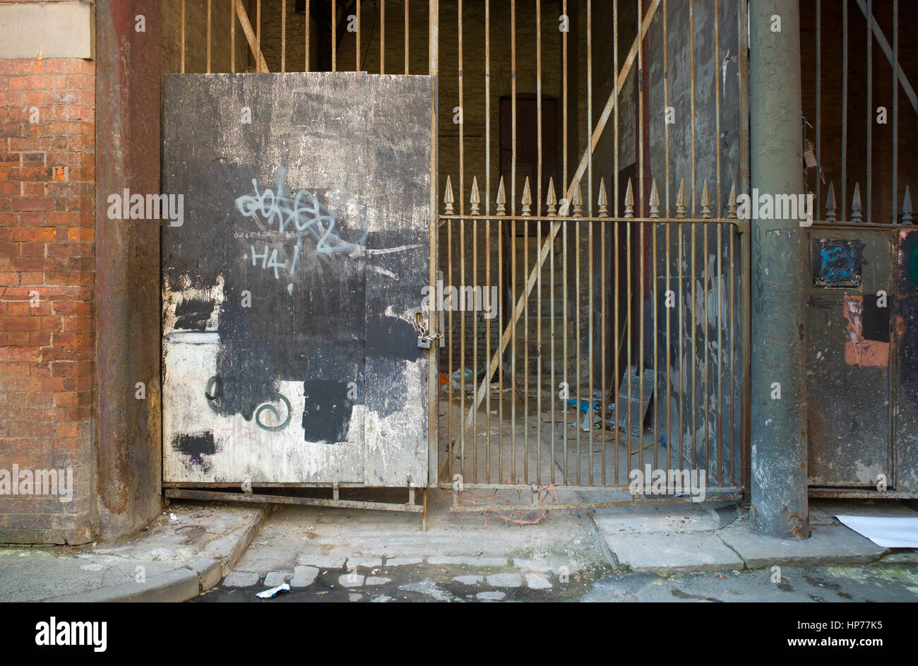 Iron gates across entrance to former warehouse, Manchester, UK Stock ...