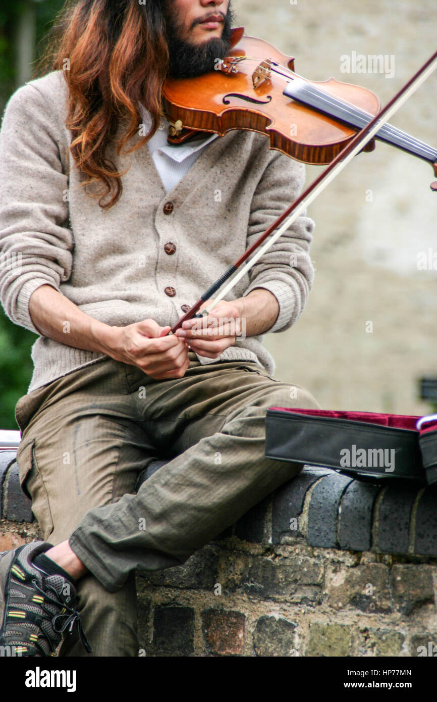 Male musical street performers playing musical instruments in Cambridge ...