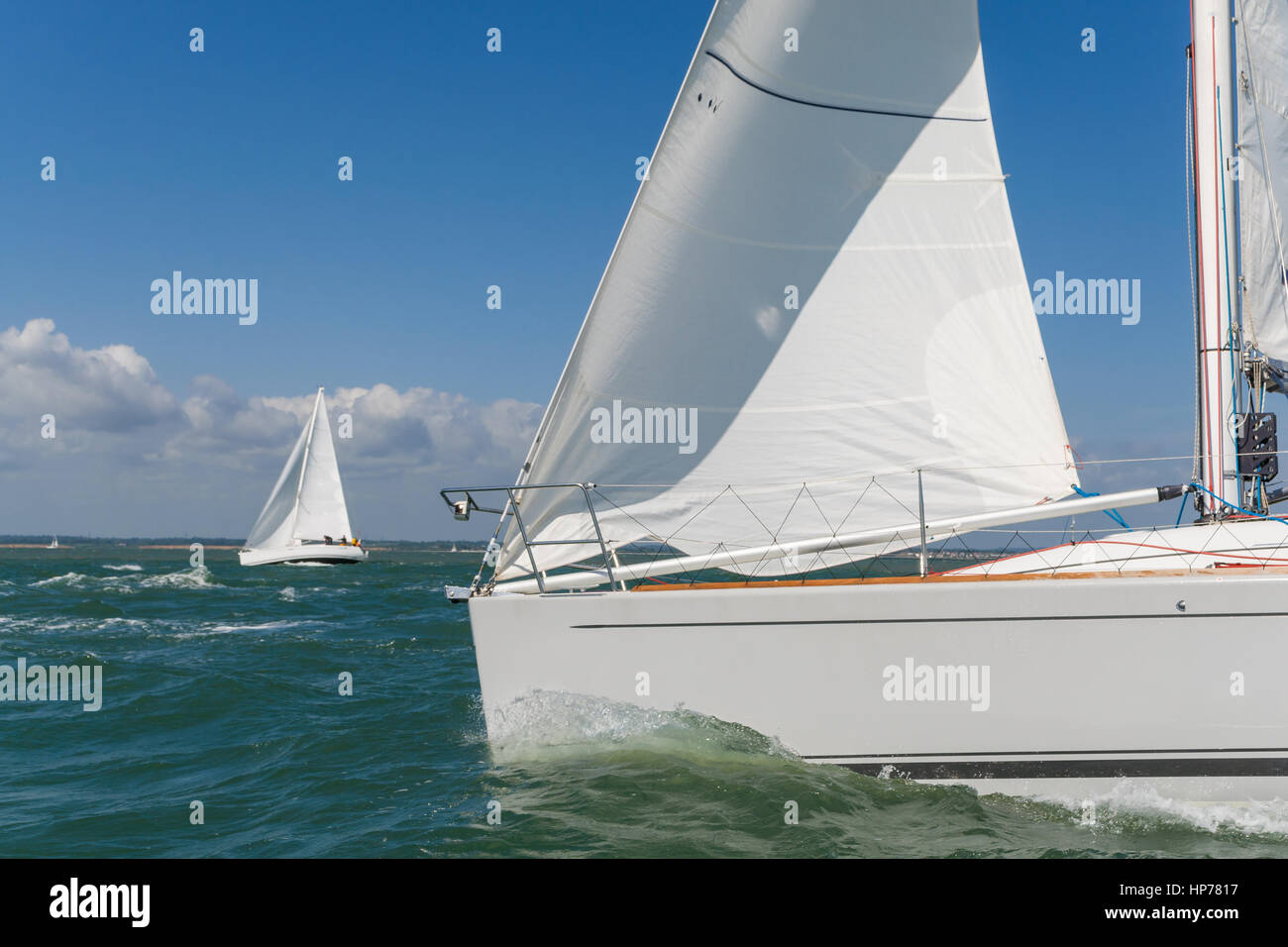 Close up of sailing boat, sail boat or yacht at sea with another white ...