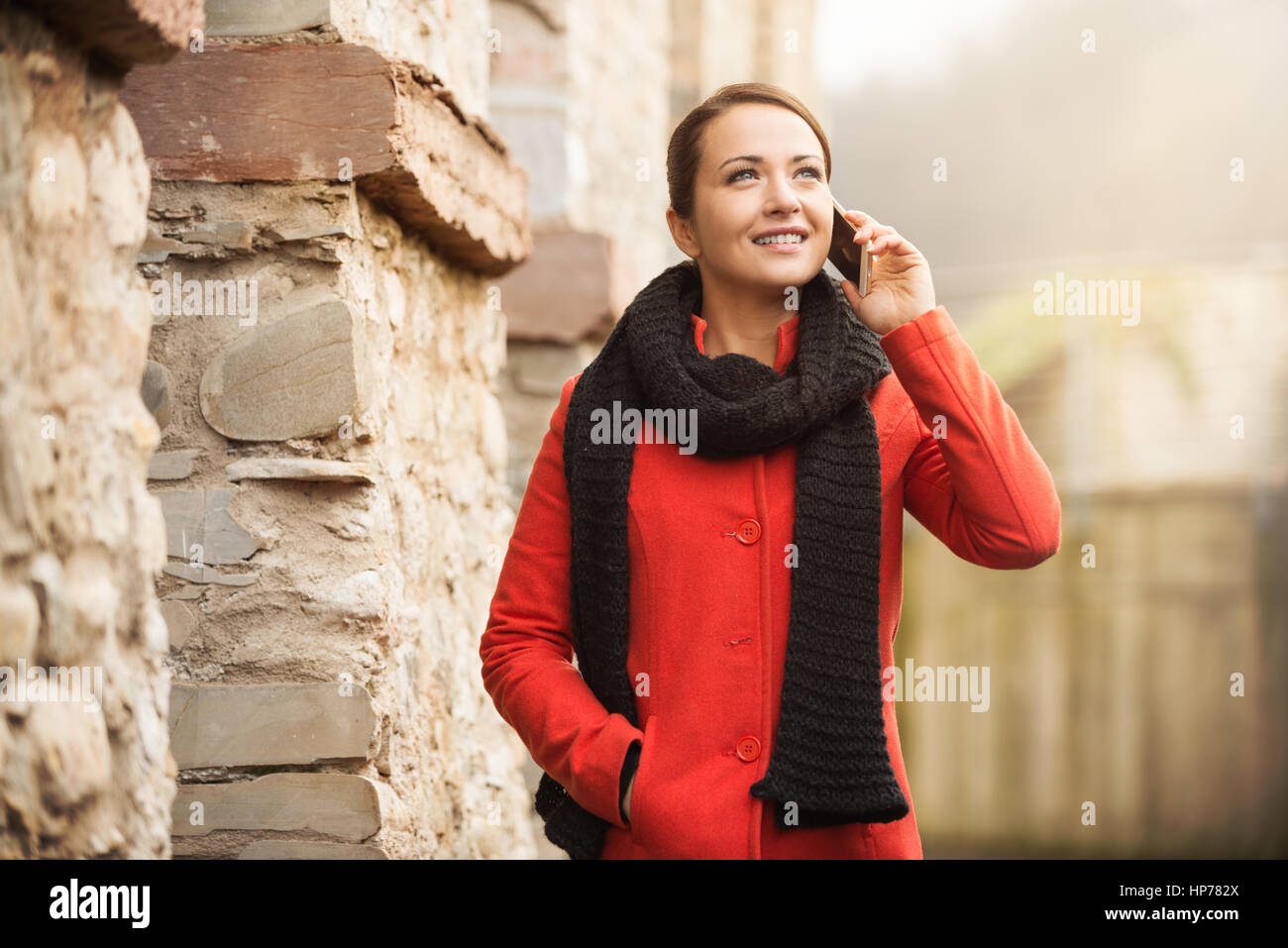 Young woman having a relaxing walk and talking on the phone Stock Photo ...