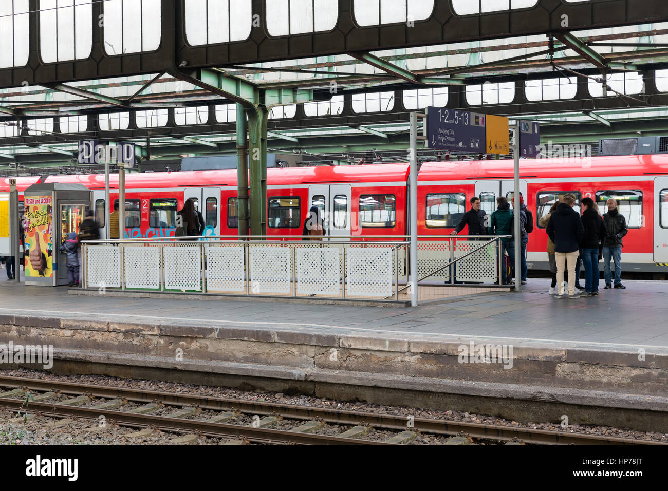 DUISBURG, GERMANY - DECEMBER 17, 2016: Travellers and trains at the ...