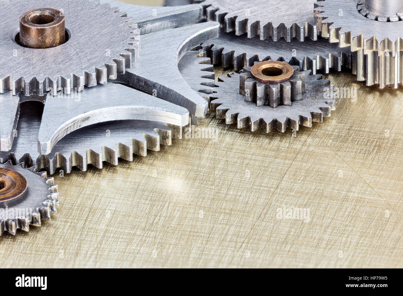 various gear cogwheels for industrial equipment on metal background ...