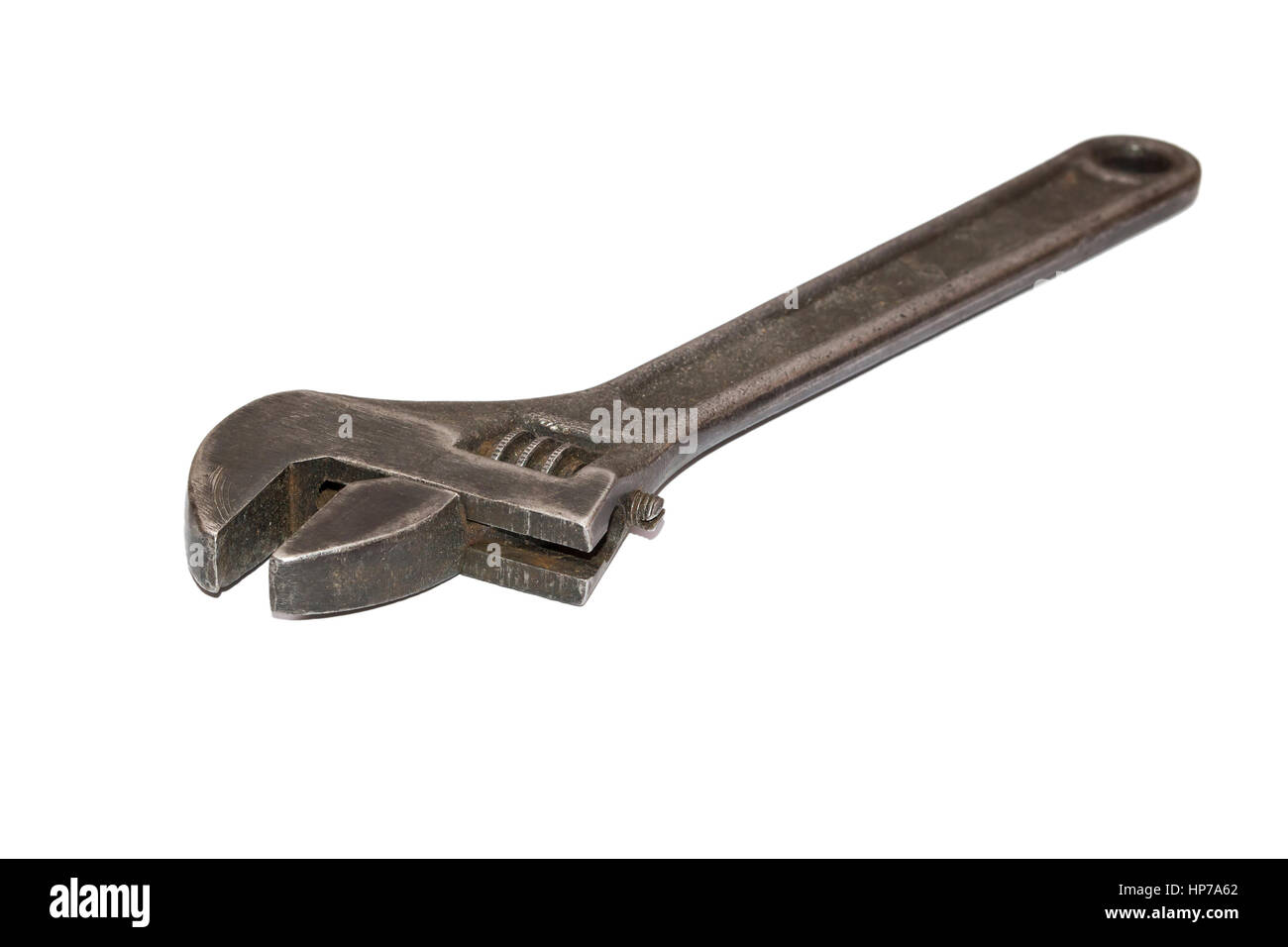 Old adjustable wrench isolated on white background Stock Photo - Alamy