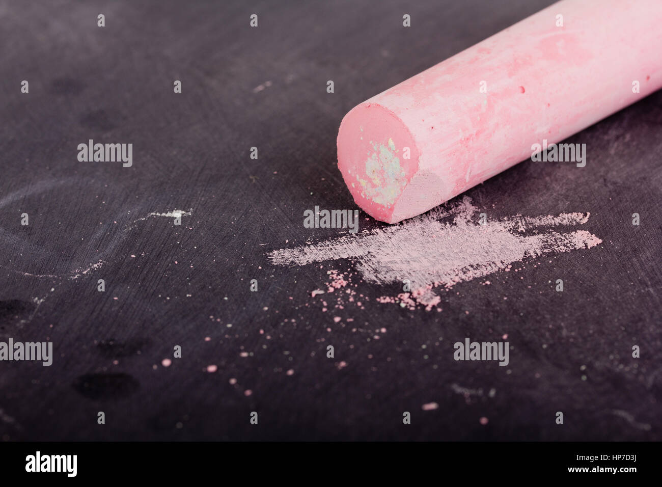 Sticks of coloured chalk on a dirty blackboard Stock Photo - Alamy