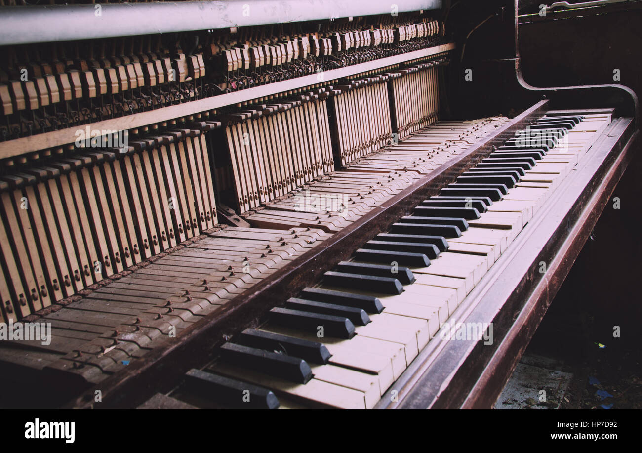 Old broken disused piano with damaged keys Vintage Retro Filter Stock ...