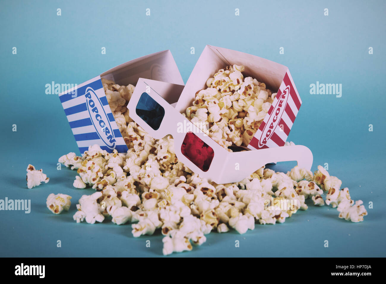 Bucket of popcorn against a blue background Vintage Retro Filter Stock ...