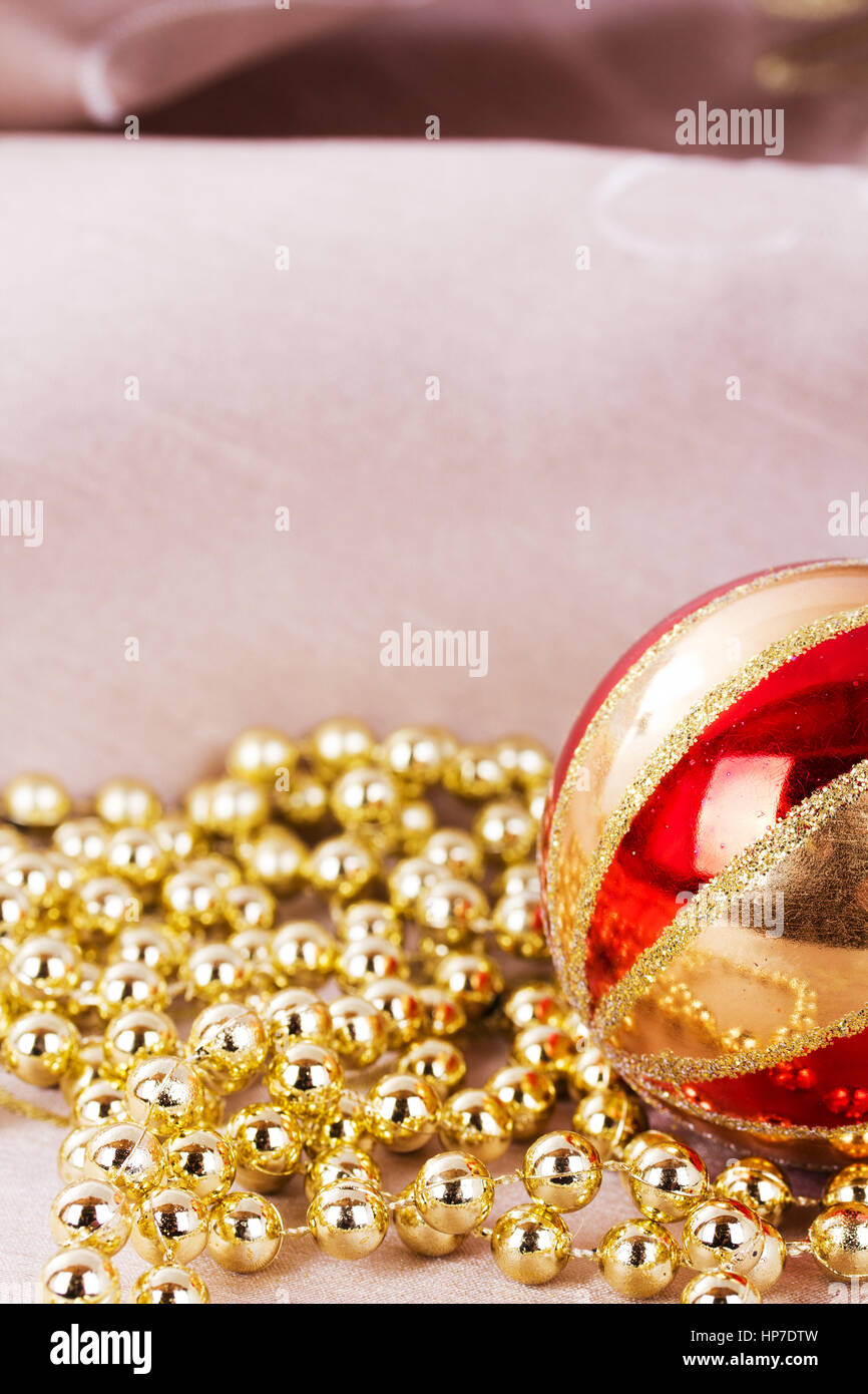 Festive gold Christmas decorations on a fabric background Stock Photo ...