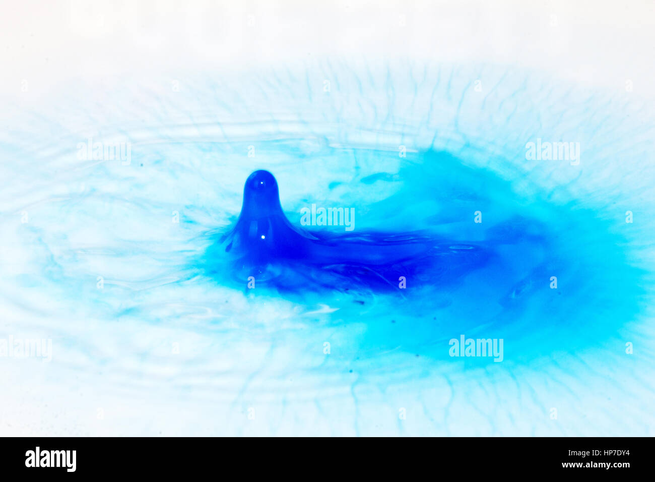 Colorful paint drop splashing on black a background Stock Photo - Alamy