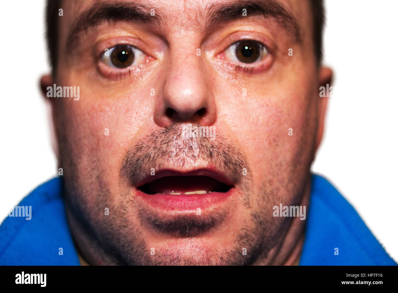 Man talking selfie while pulling funny face on white background Stock ...