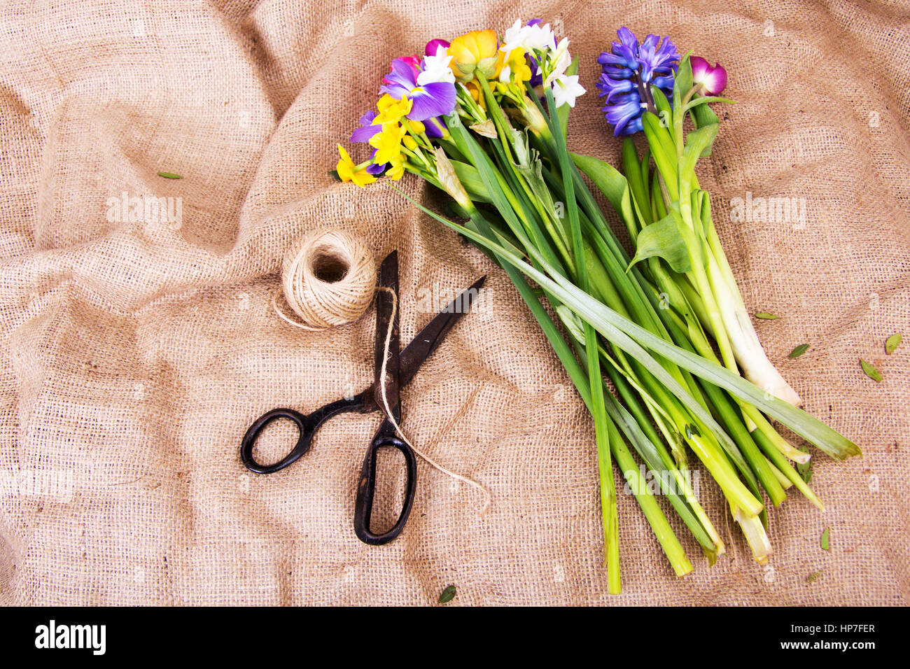 Spring cut flower arrangement against a rustic background Stock Photo ...