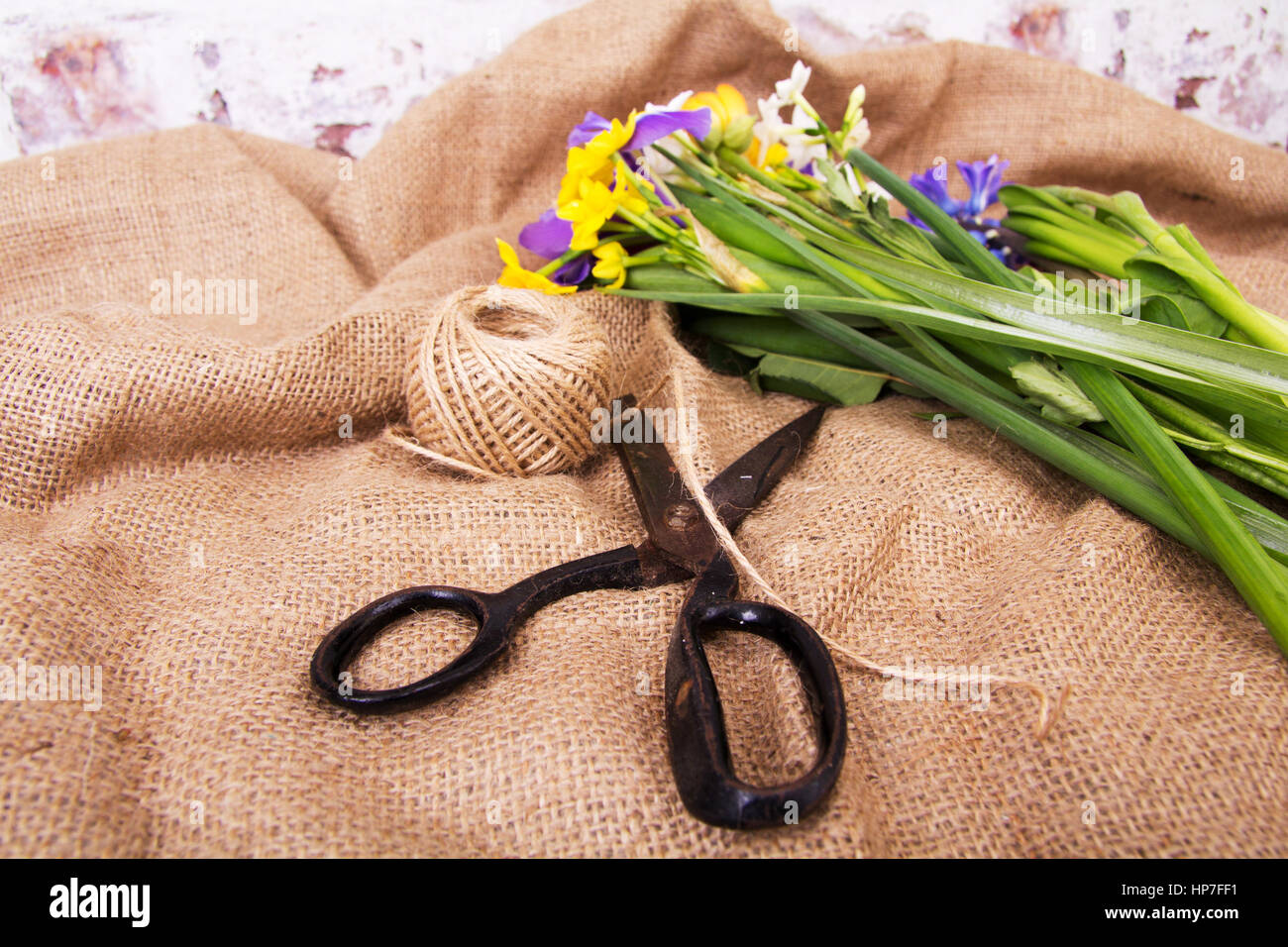 Spring cut flower arrangement against a rustic background Stock Photo ...